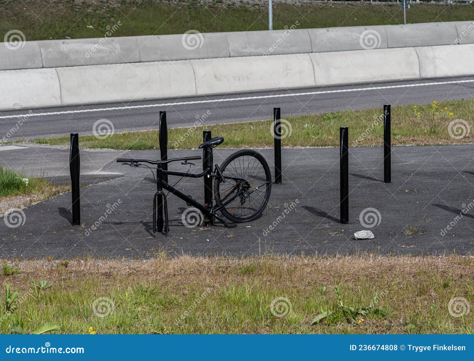 Black Bicycle Locked To a Bicke Rack. Front Wheel Stolen.. Stock Photo ...