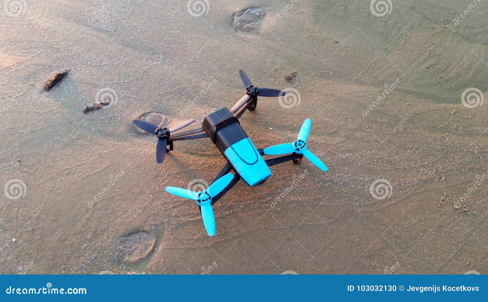 Black and Blue Drone Standing on the Sand Stock Photo - Image of ...