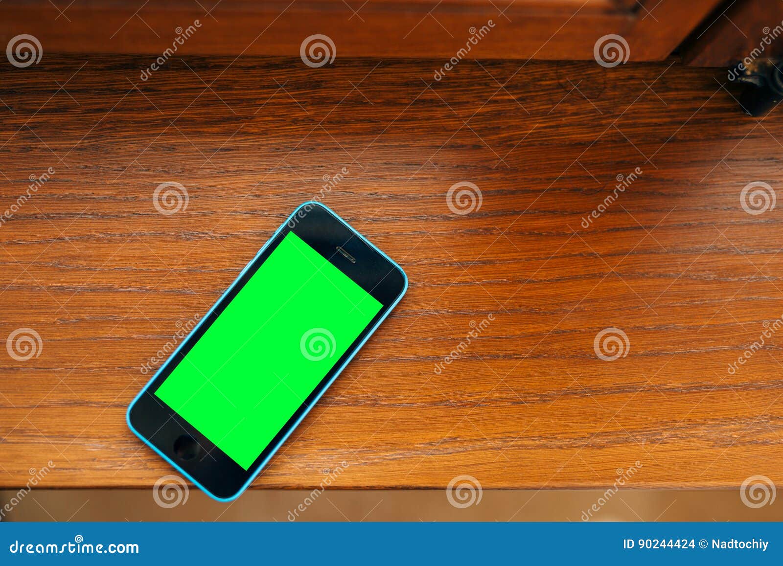 Black and Blue Phone on the Table with Green Screen Stock Photo - Image ...