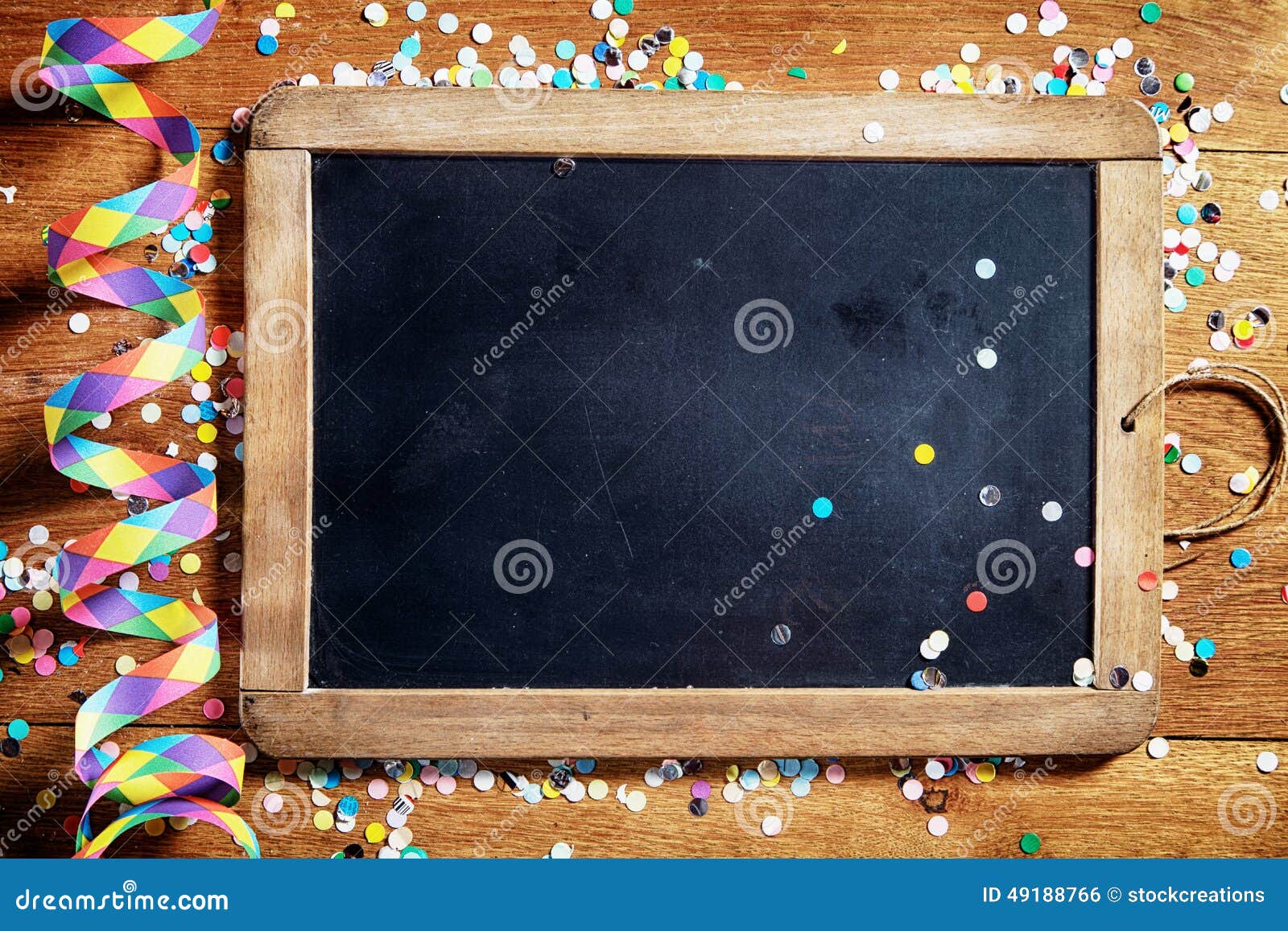 Black Board on Table with Streamers and Confetti Stock Photo - Image of ...