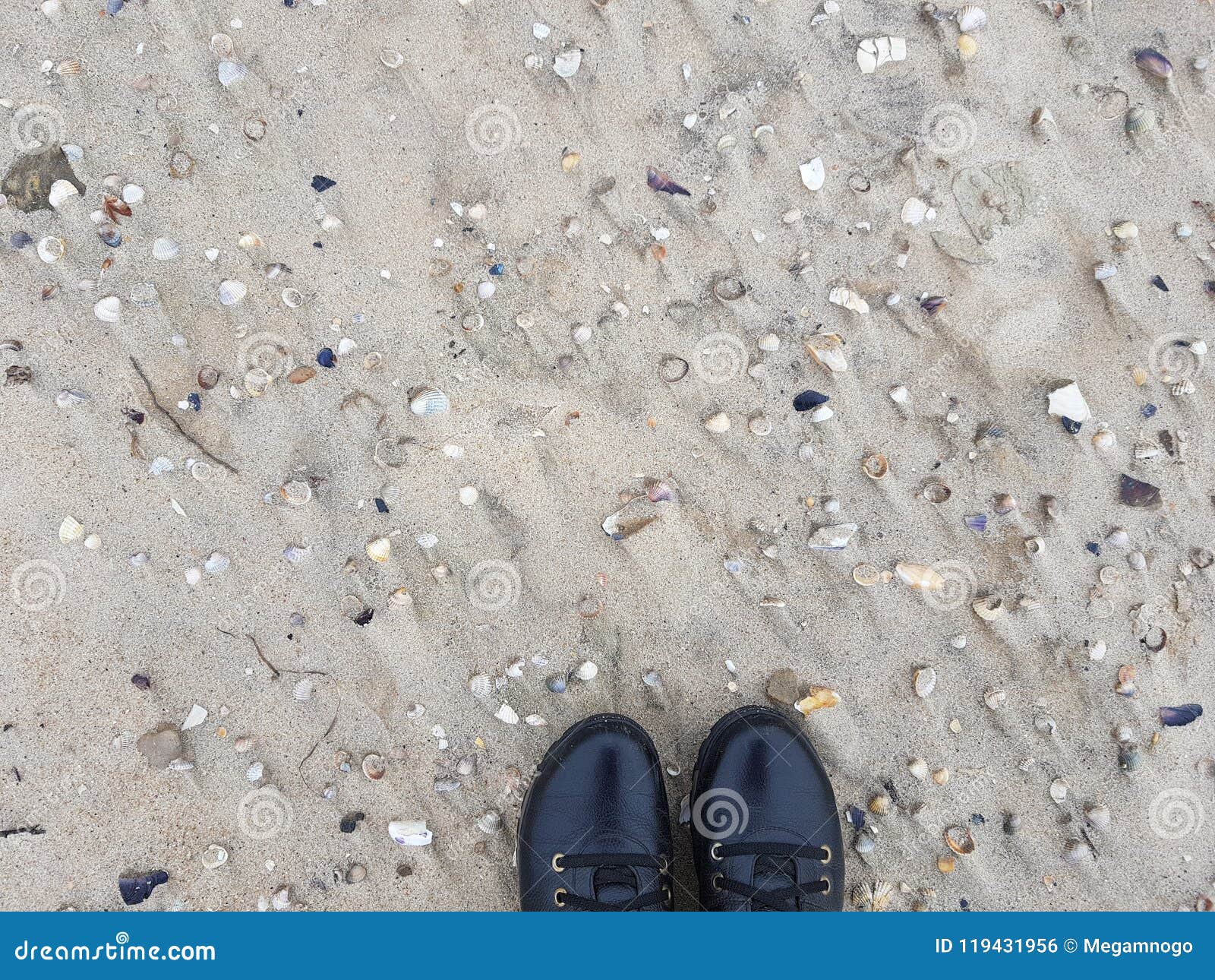 Black boots on the sand. stock photo. Image of artwork - 119431956