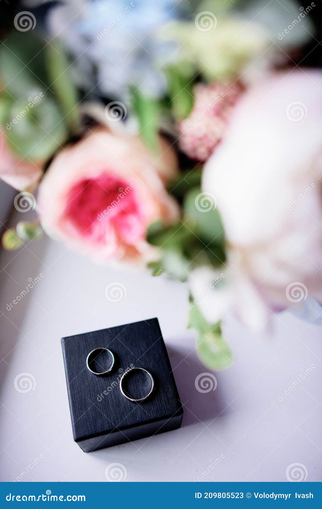 Black Box with Wedding Rings Stands Under a Pink Bouquet Stock Image ...