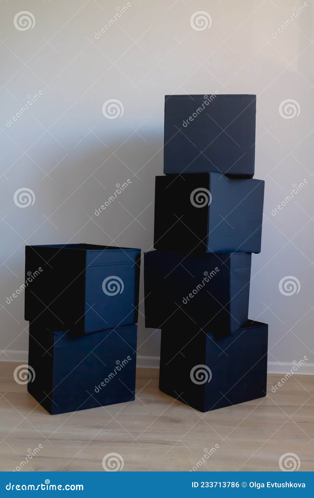 Black Boxes in the Shape of a Cube on the Background of an Old Wall ...