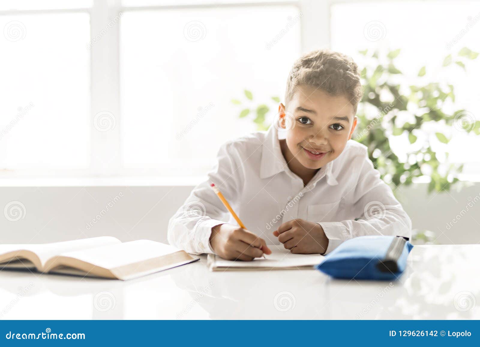 A Cute Black Boy Doing Homework at Home Stock Photo - Image of cheerful ...
