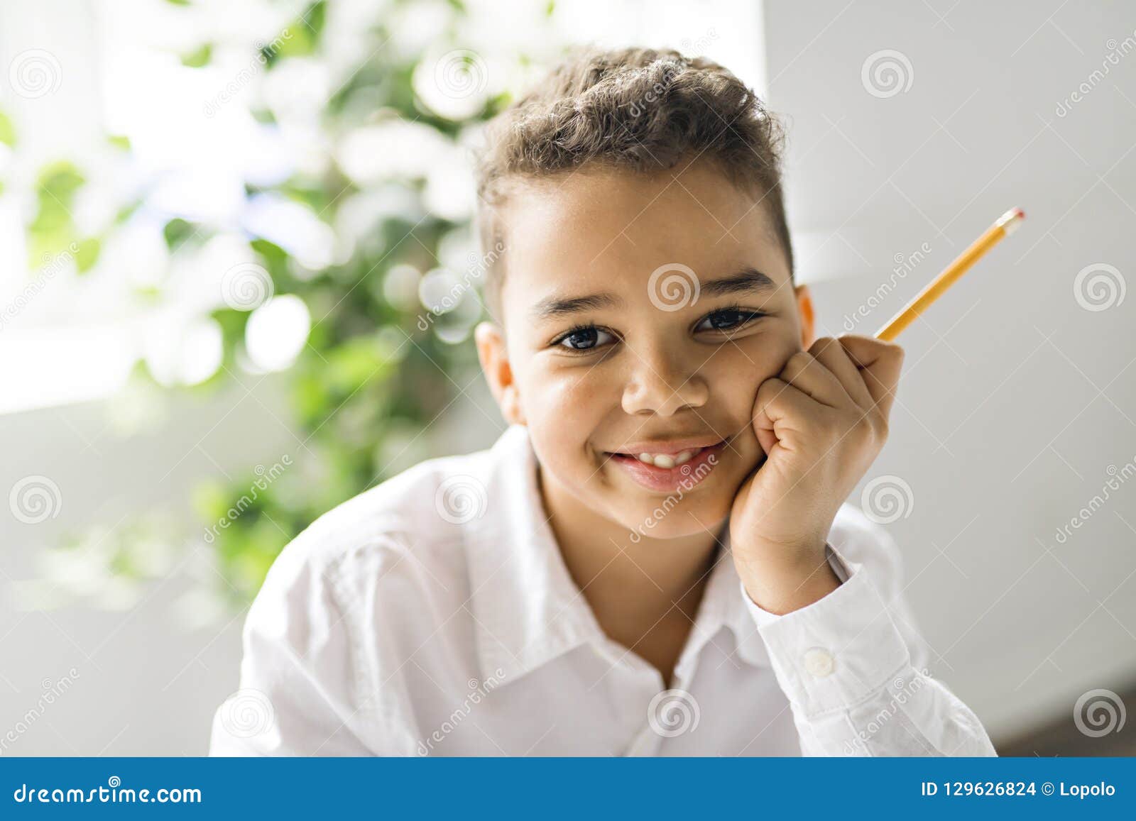 A Cute Black Boy Doing Homework at Home Stock Photo - Image of ...