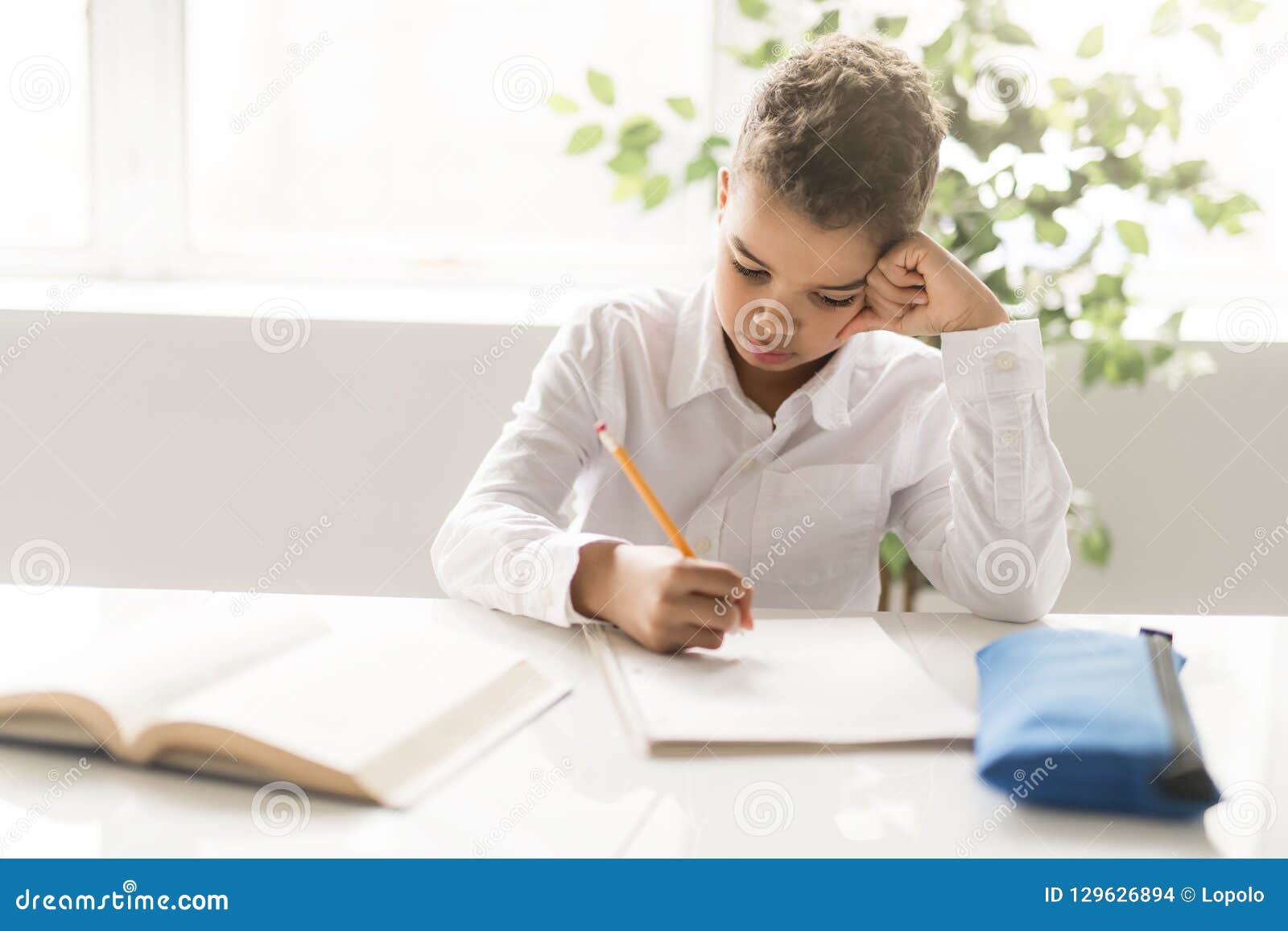 A Cute Black Boy Doing Homework at Home Stock Photo - Image of ...