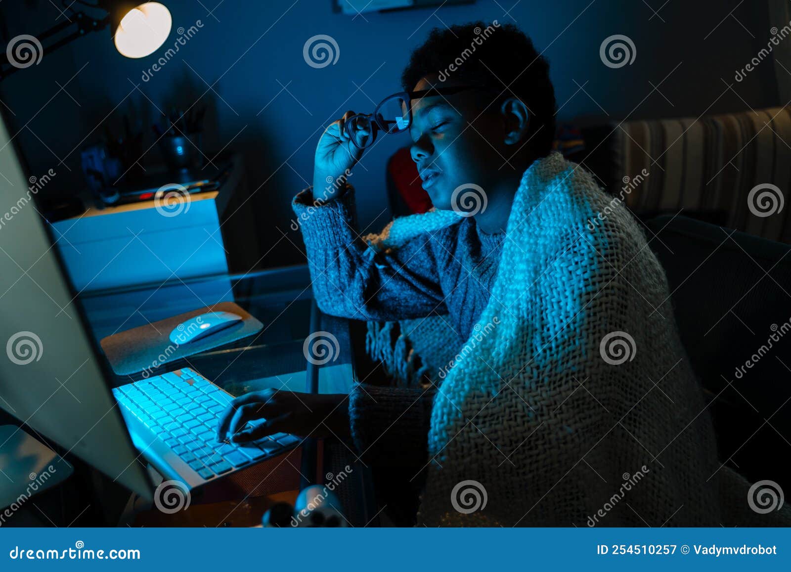 Black Boy Working with Computer while Sitting at Table at Home Stock ...