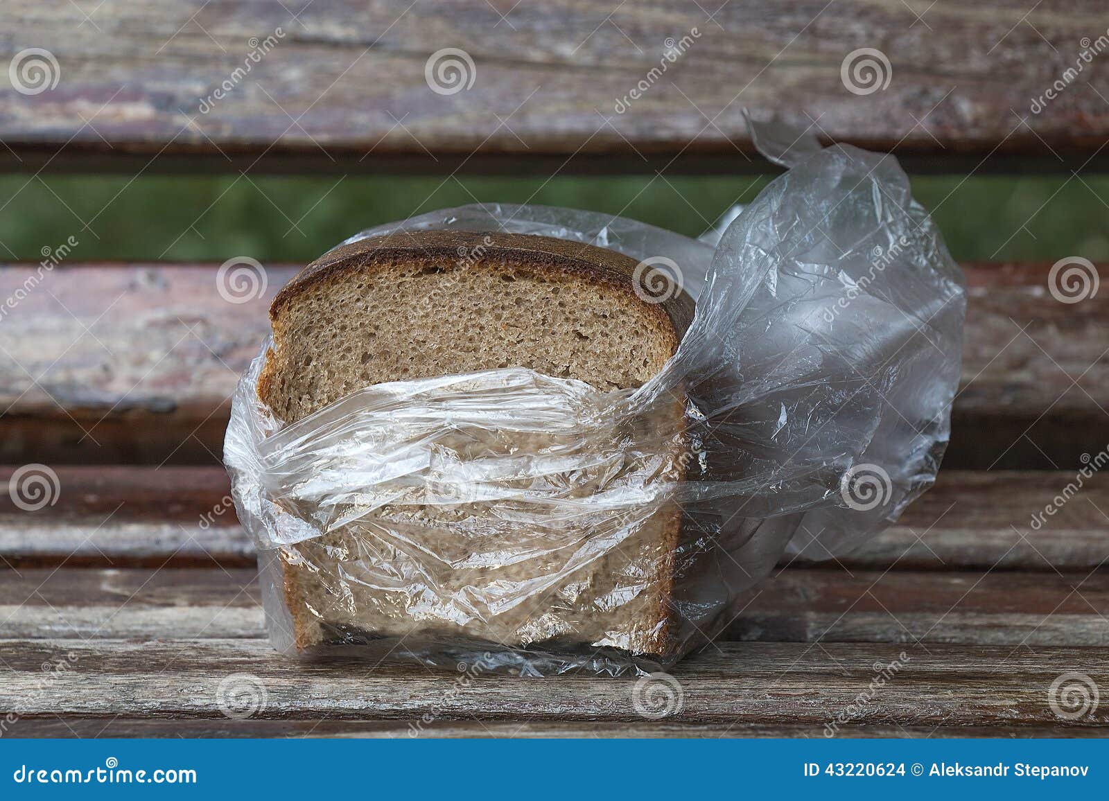 Black Bread on a Bench in a Transparent Plastic Bag Stock Photo - Image ...