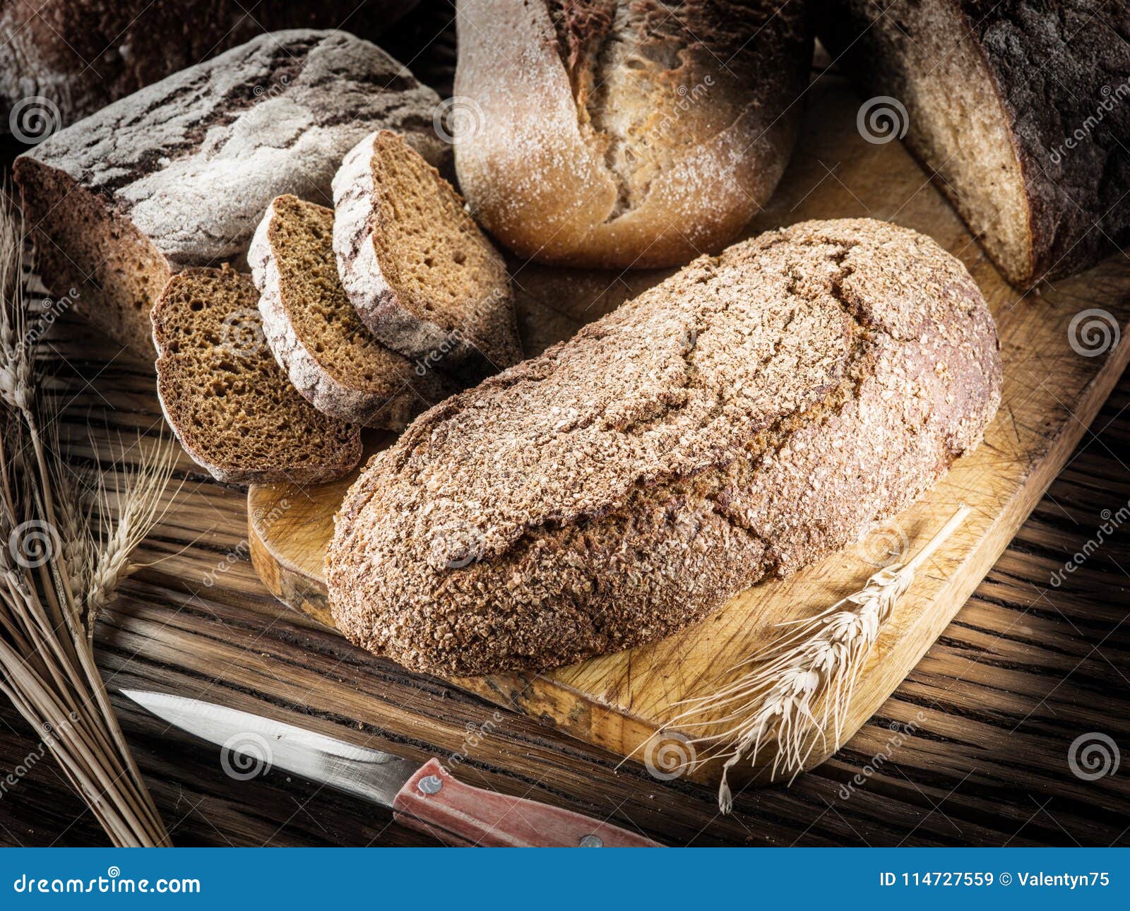 Black Bread Loafs on the Wooden Plank. Stock Image - Image of golden ...