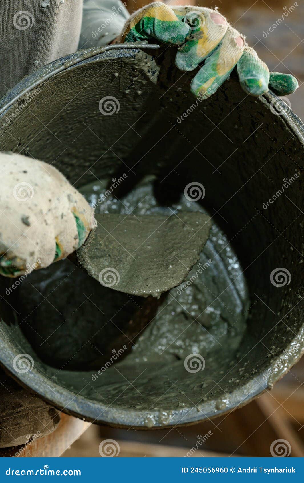 Black Bucket with Liquid Mortar for the First Layer of Plaster for the ...