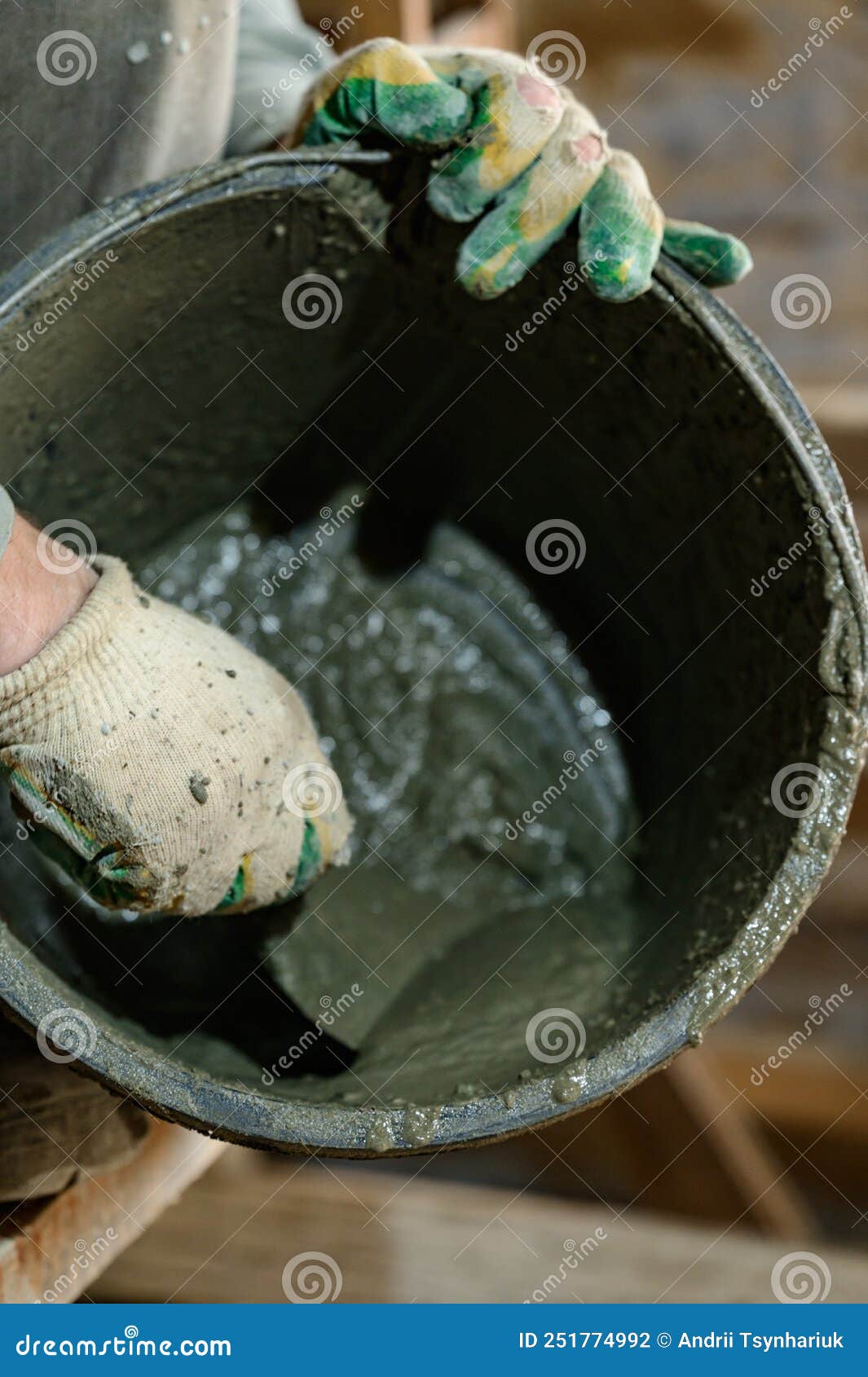 Black Bucket with Liquid Mortar for the First Layer of Plaster for the ...