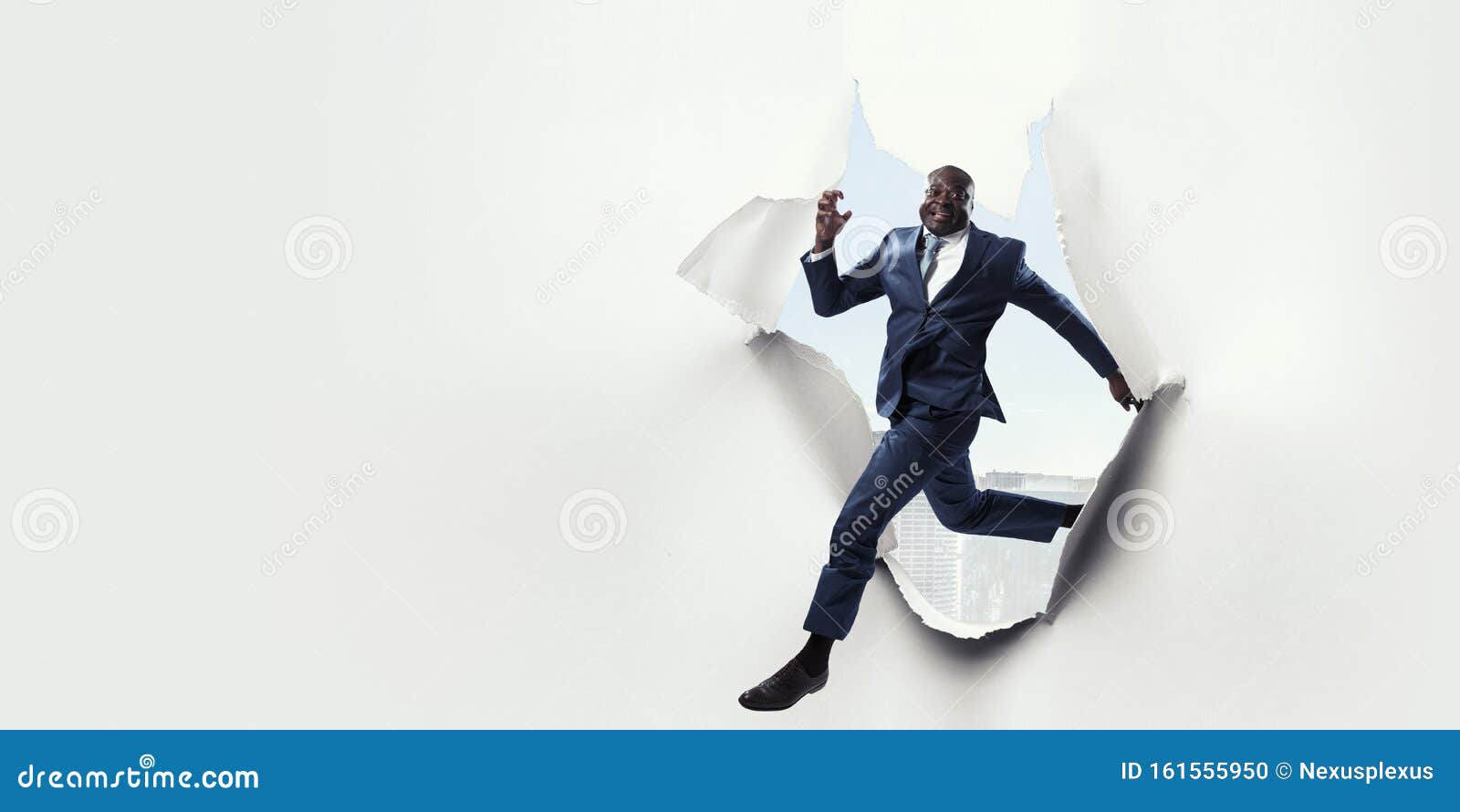 Breakthrough Paper Hole with a Black Businessman Stock Photo - Image of ...