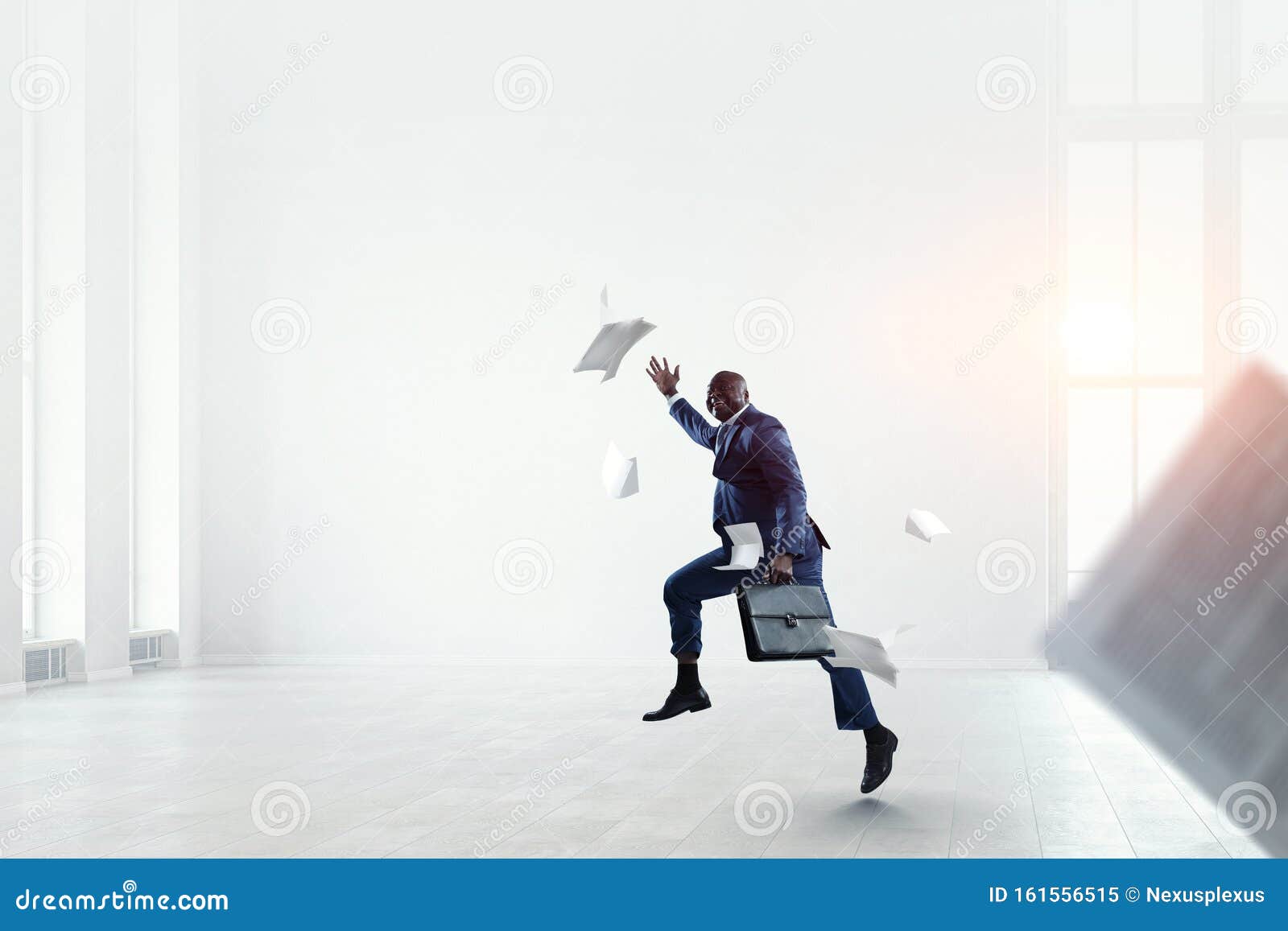 Black Businessman with Briefcase Running among Flying Papers Indoor ...