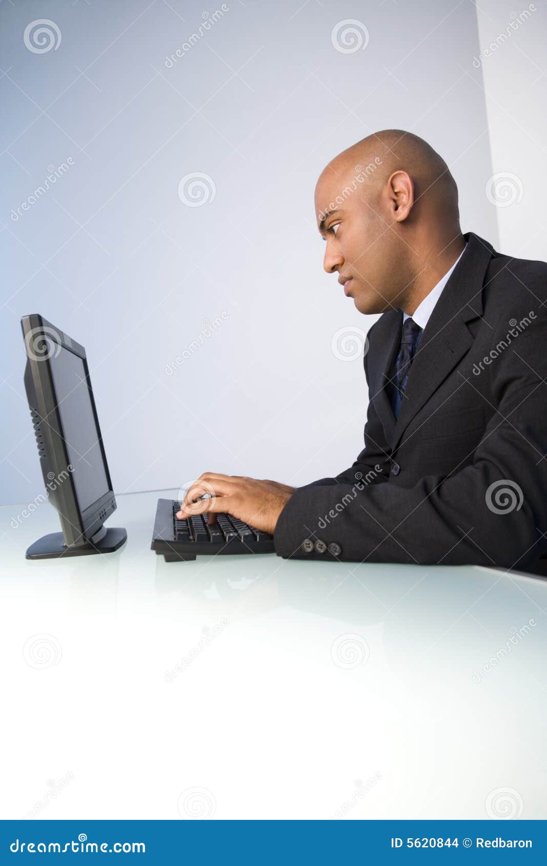 Black Businessman on Computer Stock Photo - Image of desk, computer ...