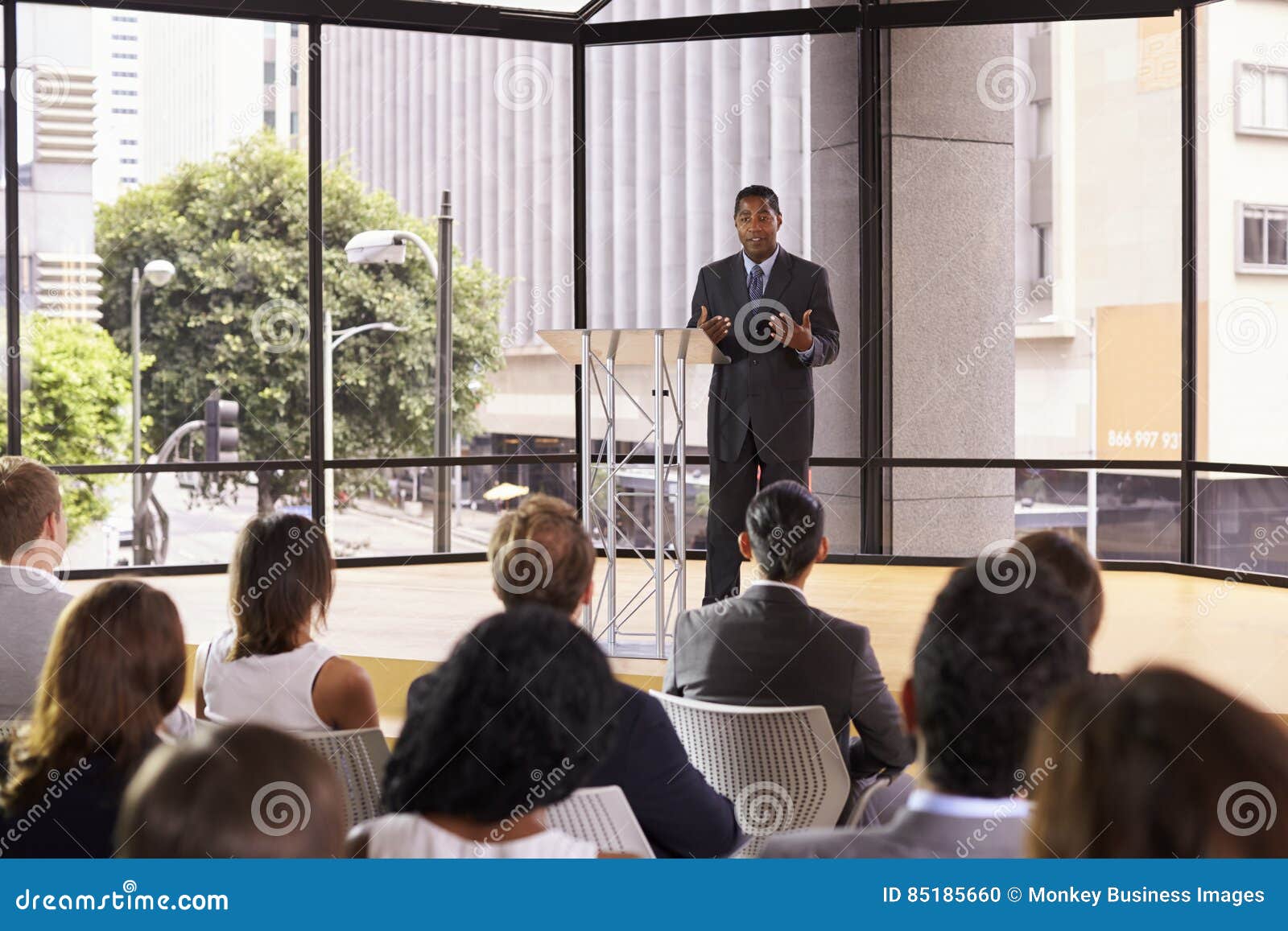 Black Businessman Presenting Seminar Gesturing To Audience Stock Photo ...