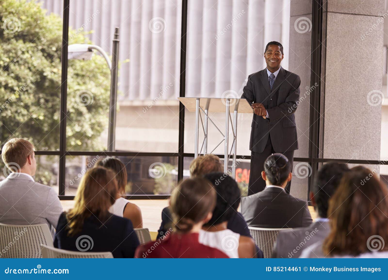 Black Businessman Presenting Seminar Smiling To Audience Stock Image ...