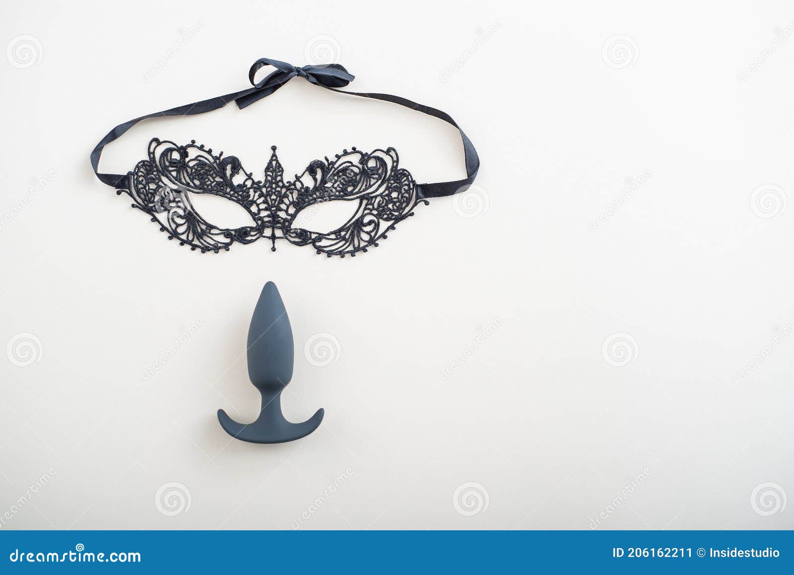 Black Plug and Lace Mask on White Background. Stock Image - Image of ...