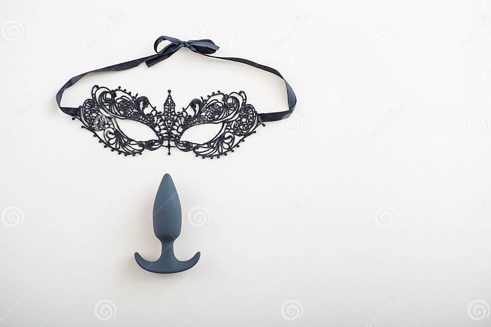 Black Plug and Lace Mask on White Background. Stock Image - Image of ...