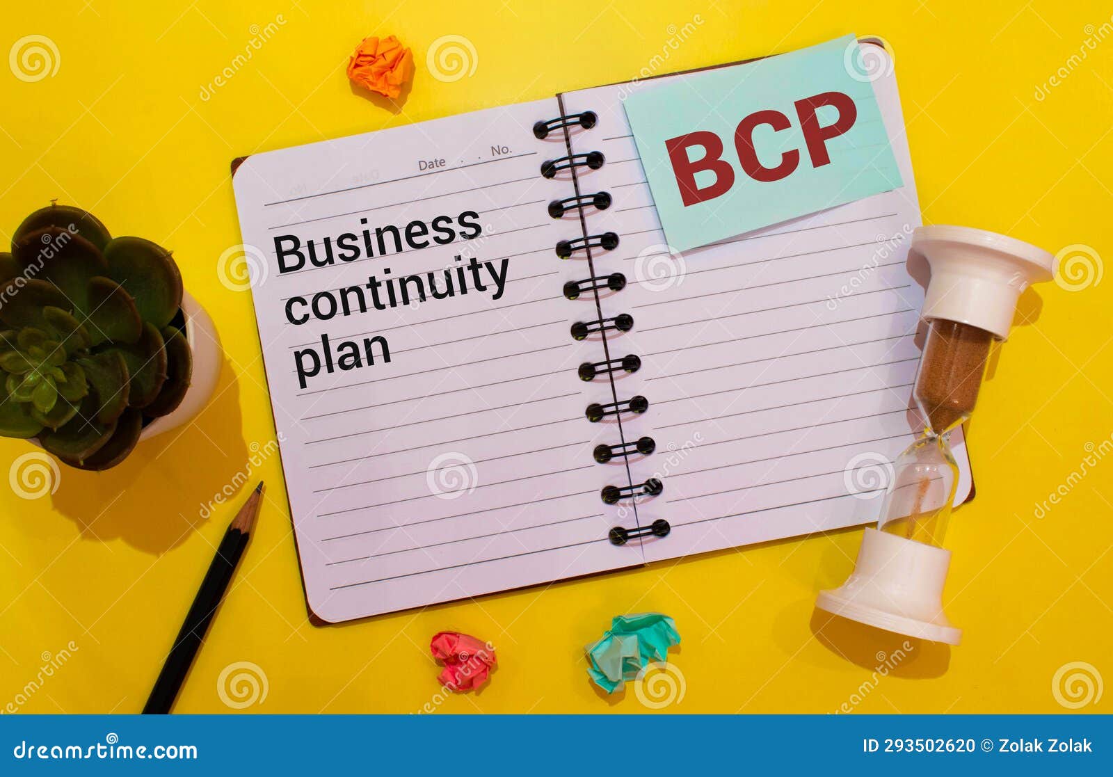 A Black Calculator, a Pen, and a Notebook with the Text BCP Business ...