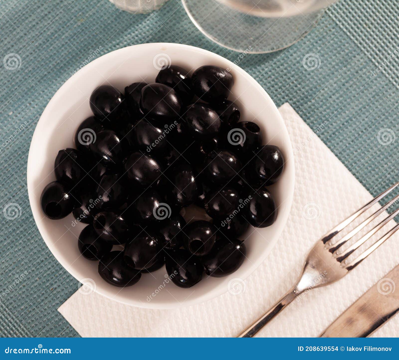 Seedless Black Olives in Bowl on Table Stock Photo - Image of berry ...
