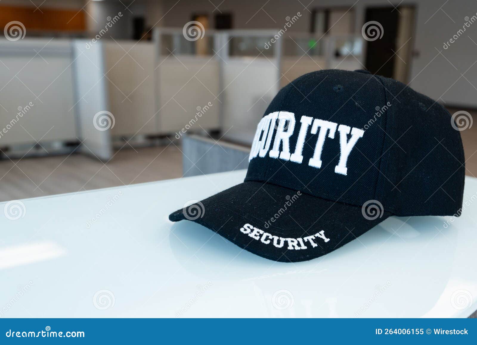 Black Cap with Embroidered Words "security" on an Office Front Desk ...