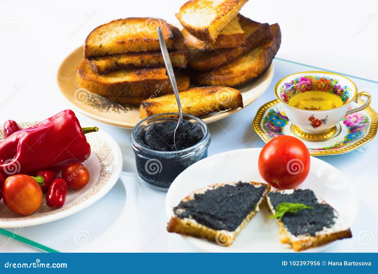 Caviar, Vegetable and Sliced Fried Bread on Table. Stock Photo - Image ...