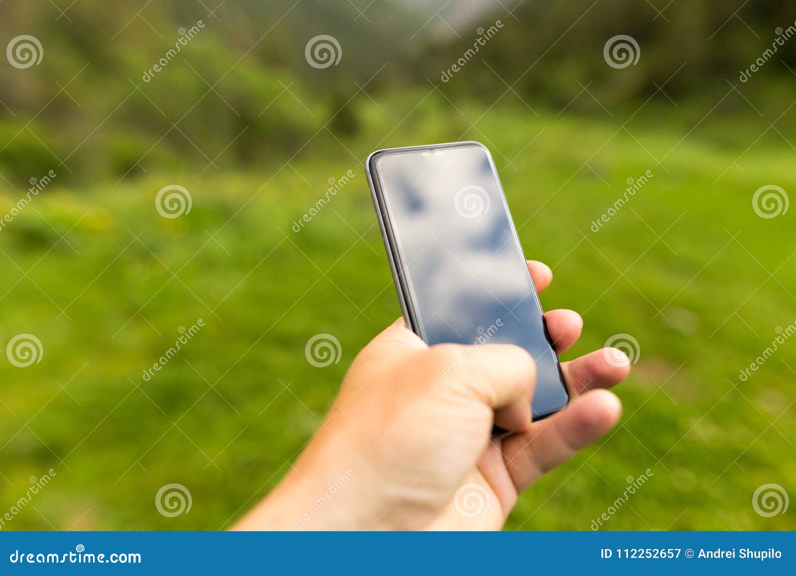 Black Cell Phone in a Hand Outdoors Stock Image - Image of cell, girl ...