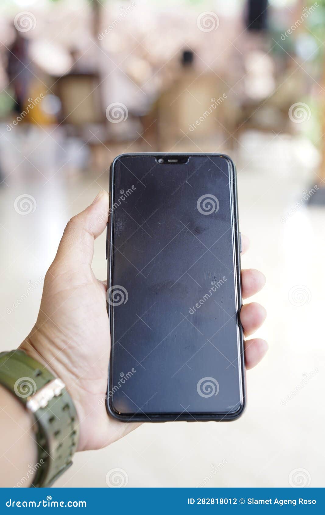 A Black Cell Phone in Hand. Stock Photo - Image of hand, watch: 282818012