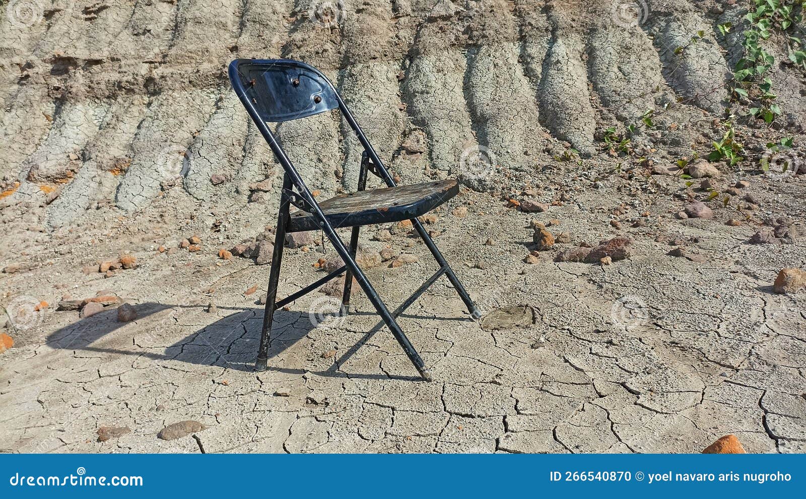 A Black Chair on the Ground Photographed at Eye Level Stock Photo ...