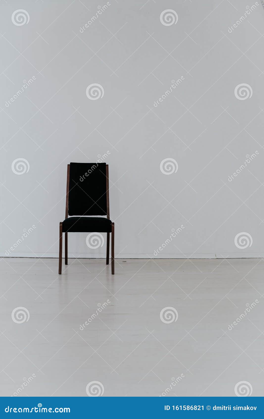 Black Chair in the Interior of an Empty White Room Stock Image - Image ...