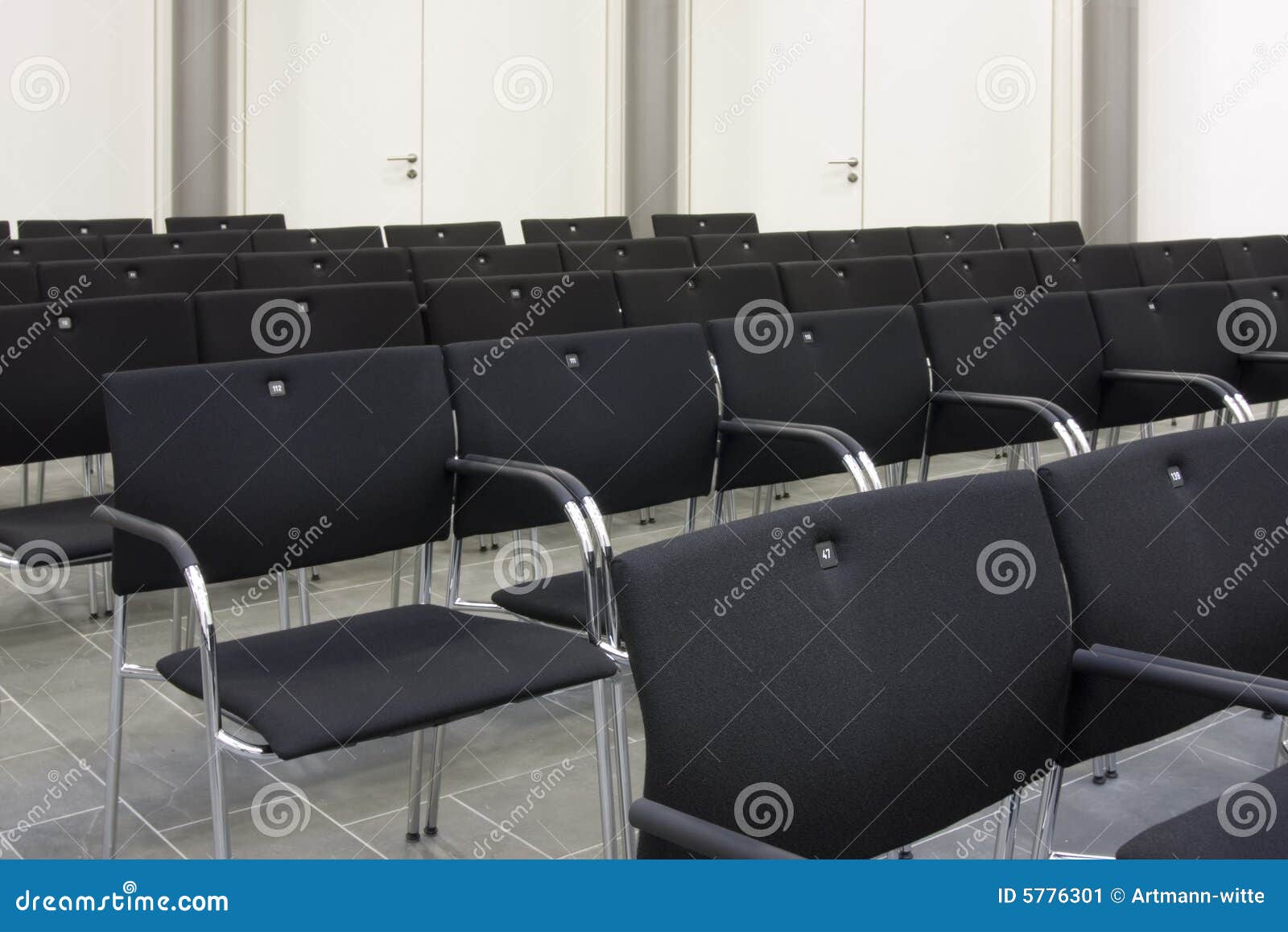 Black chairs in a row stock image. Image of furniture - 5776301
