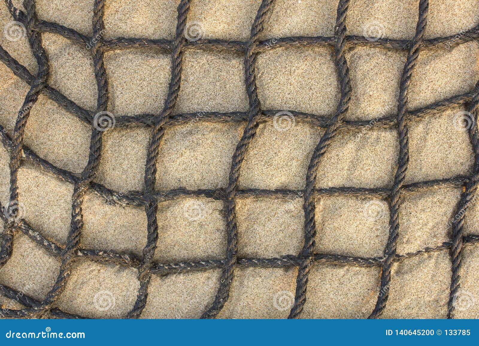 Black Checkered Rope Net on Light Sand Close Up. Natural Surface ...