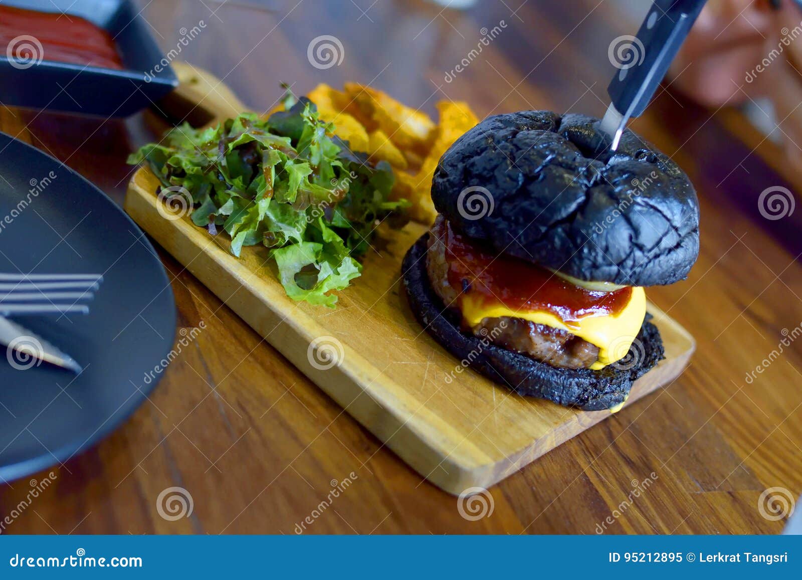 Black cheese burger stock image. Image of food, knife - 95212895