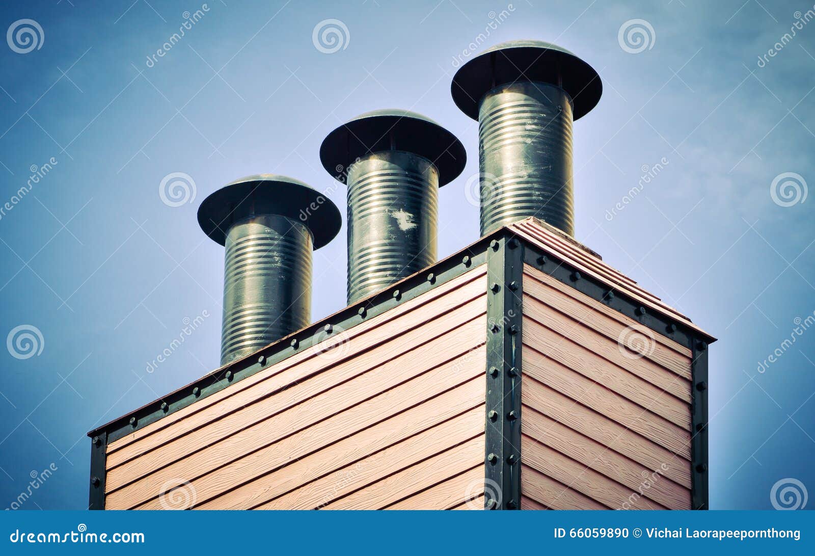 Black Chimneys Against the Blue Sky Stock Photo - Image of flue ...