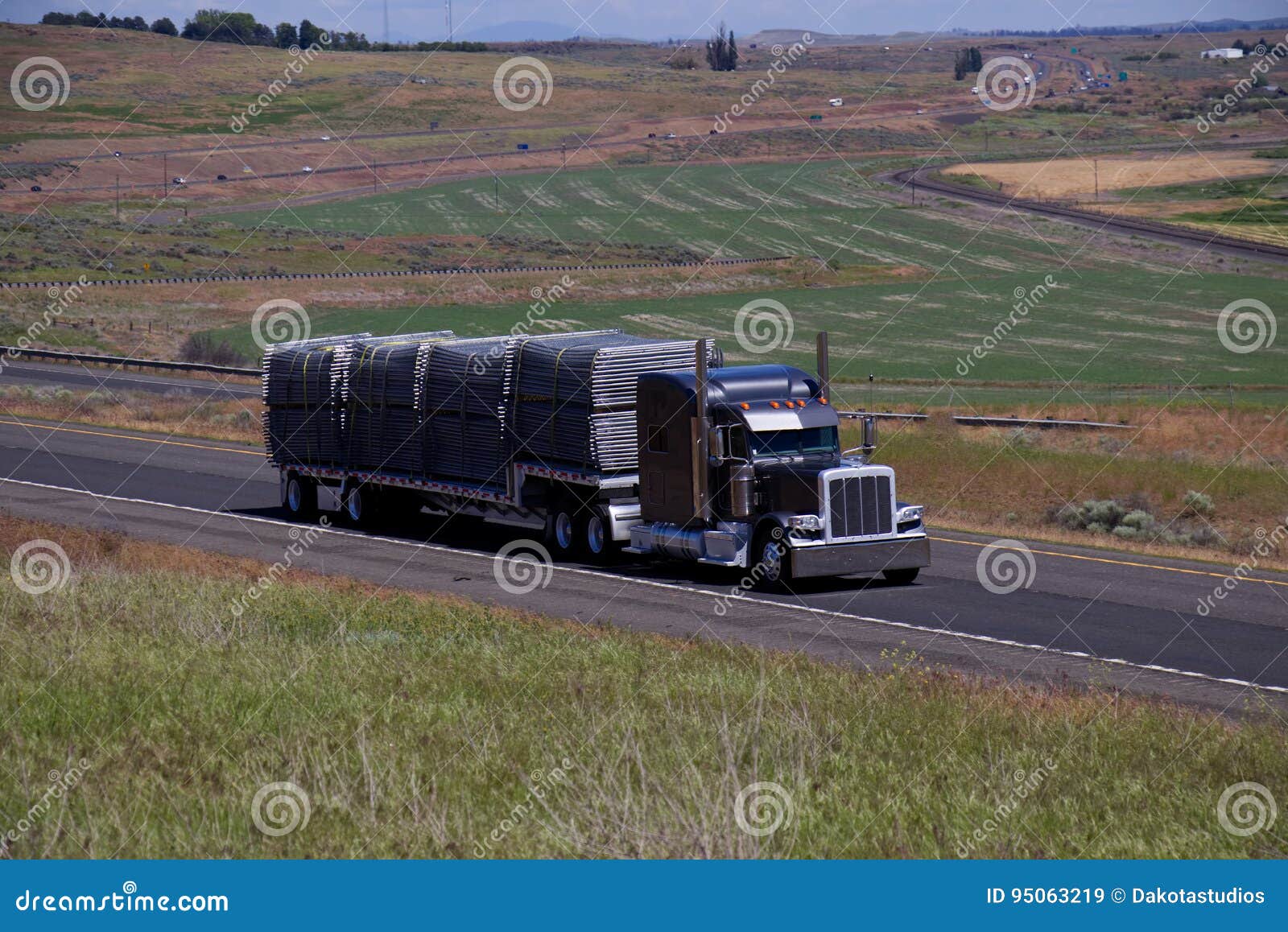 Black Classic Peterbilt / Loaded Flatbed Stock Image - Image of driving ...