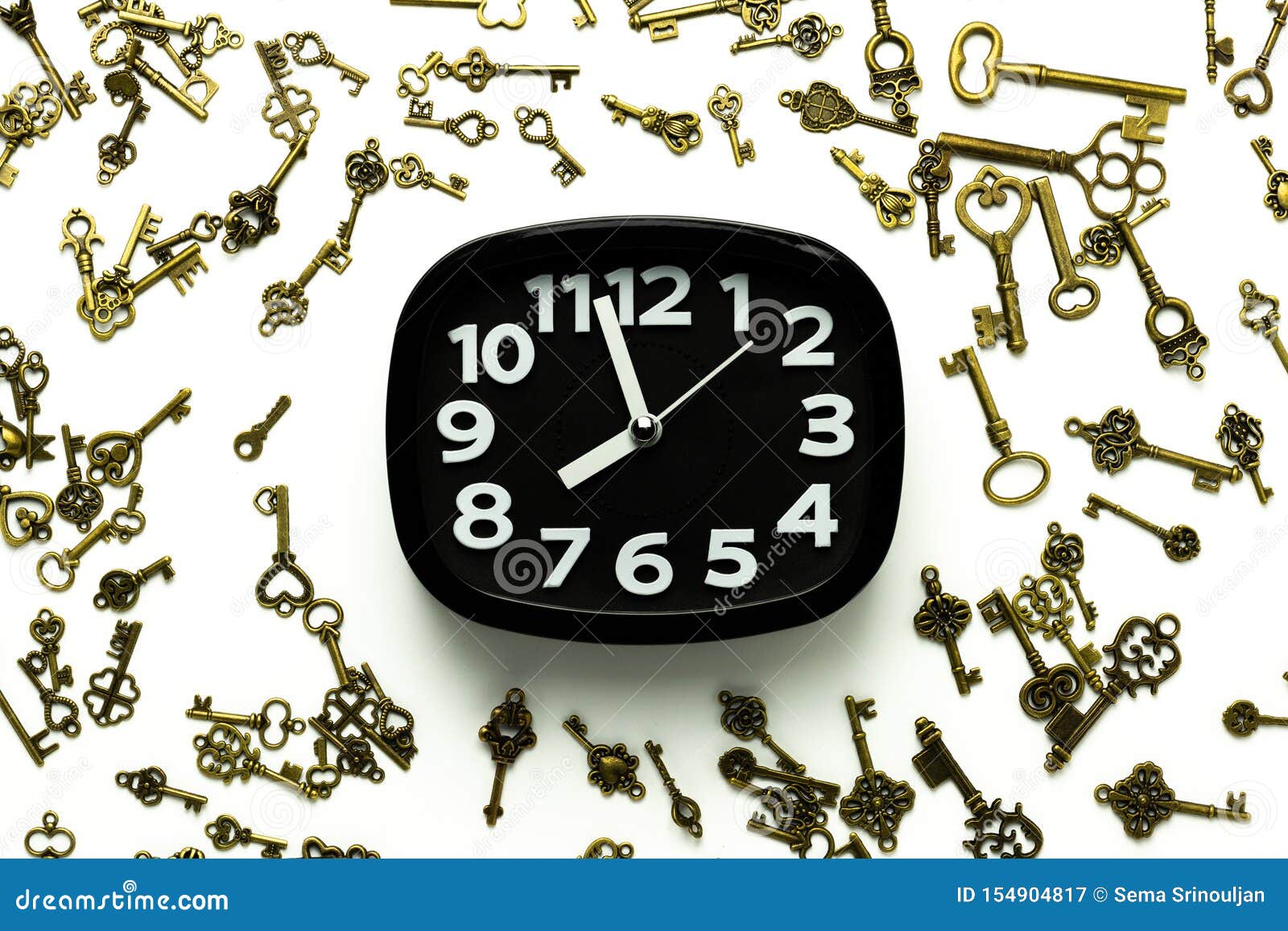 Black Clock and Pile of Keys Isolated on White Background Stock Image ...