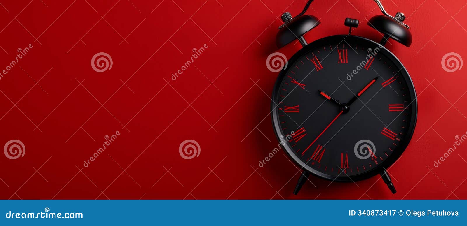 A Black Clock on a Red Wall Two Bells Flank Each Side Hands on Opposite ...