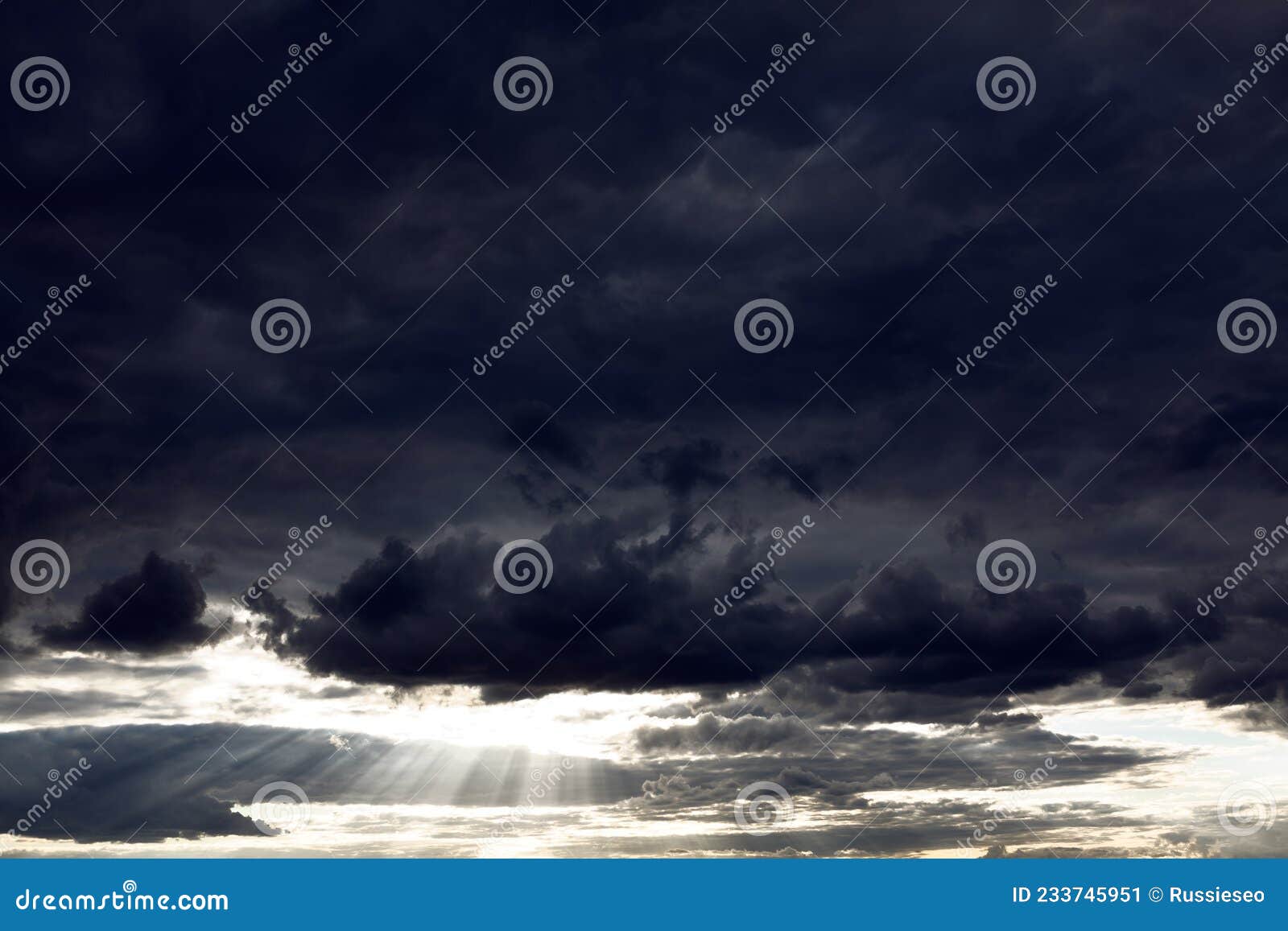 Black clouds with sun rays stock image. Image of color - 233745951