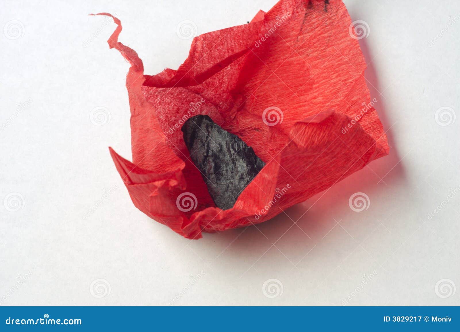 Black coal in red paper stock image. Image of coal, humor - 3829217