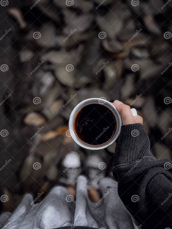 Black coffee on hand girl stock image. Image of face - 226598409
