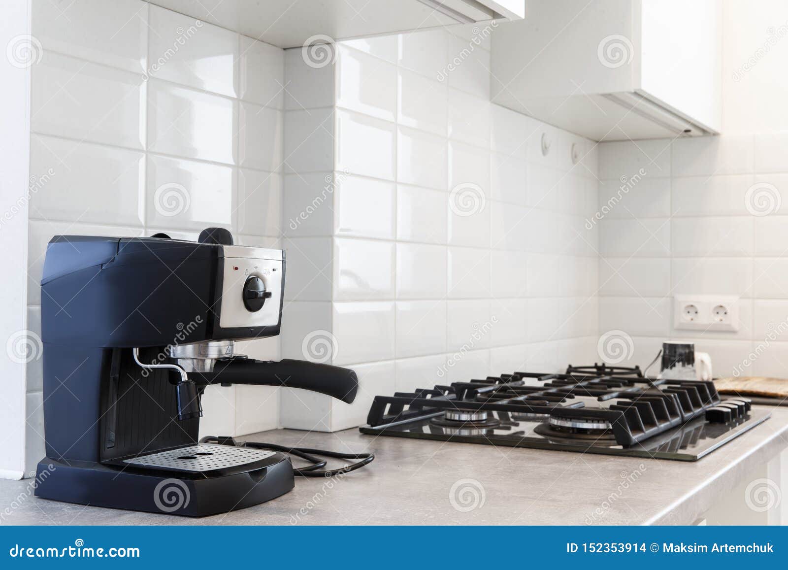Black Coffee Machine Standing on the Table Surface Near the White Wall ...