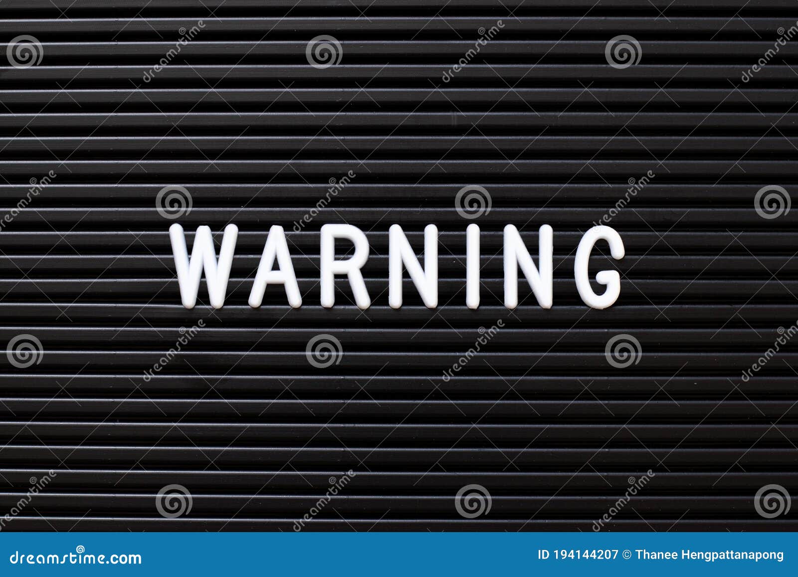 Black Felt Letter Board with White Alphabet in Word Warning Background ...