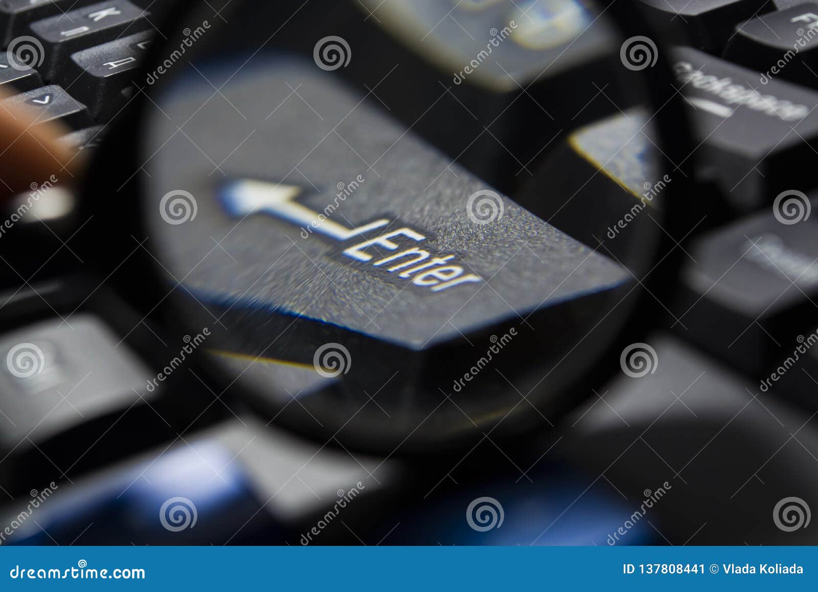 Black Computer Keyboard. the Button an Enter Under a Magnifying Glass ...