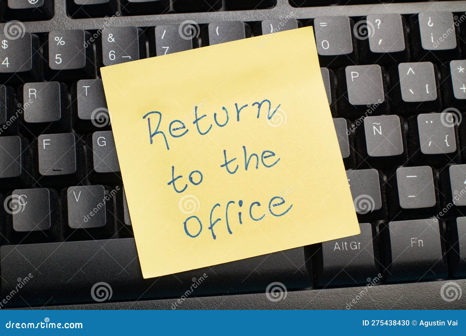 A Black Computer Keyboard and a Paper Note with Return To the Office ...
