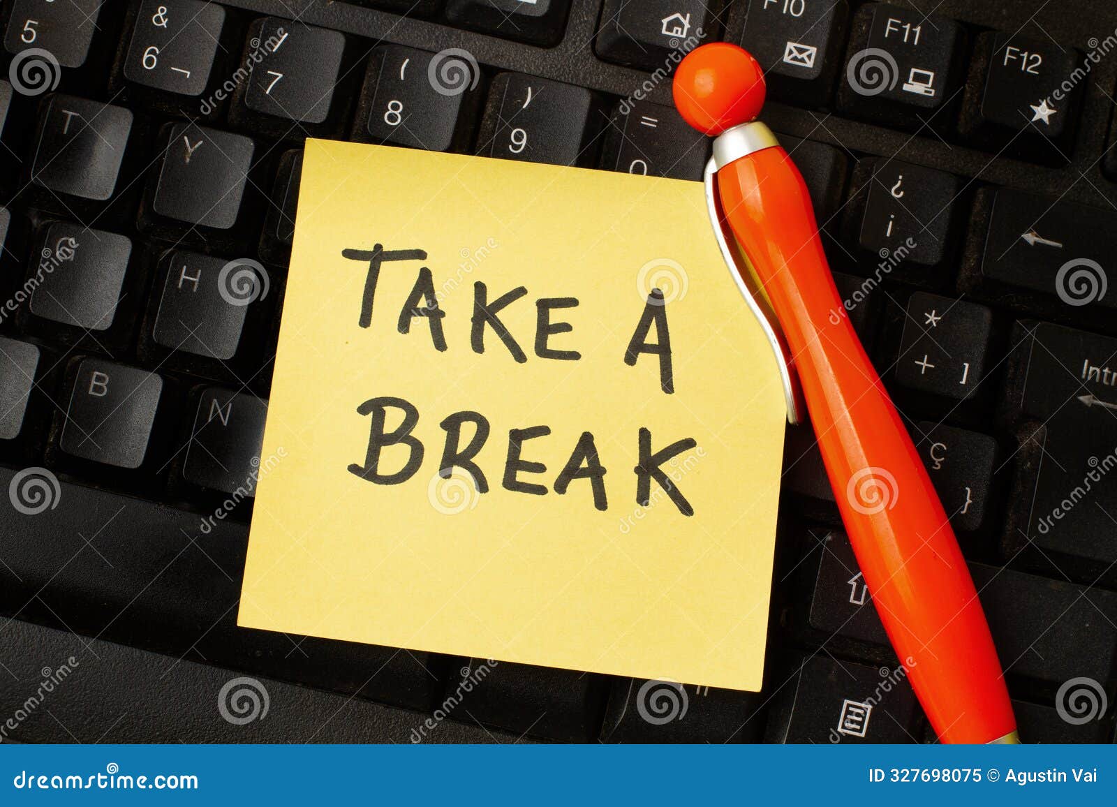 Black Computer Keyboard with a Yellow Paper Note with Take a Break ...