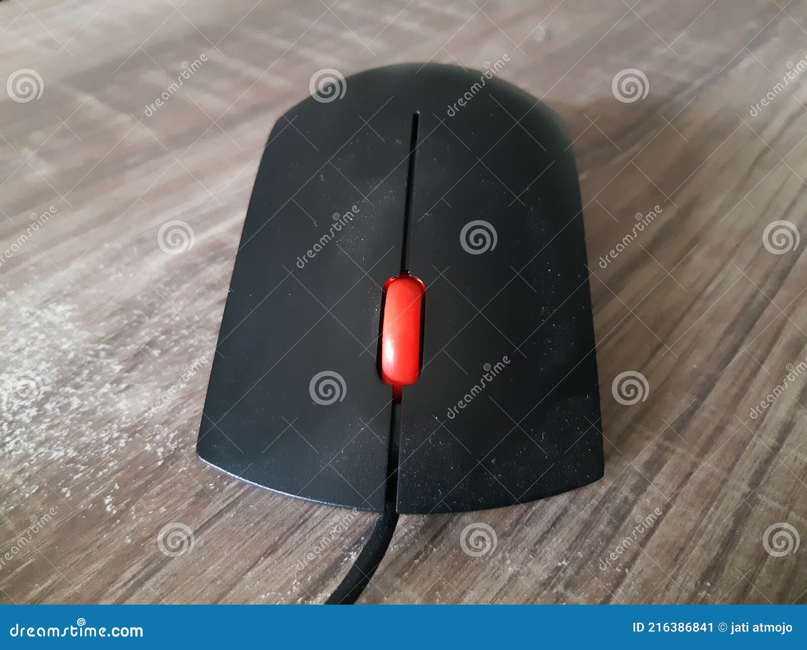 Black Computer Mouse with Red Scroll Button on Wooden Table. One Part ...
