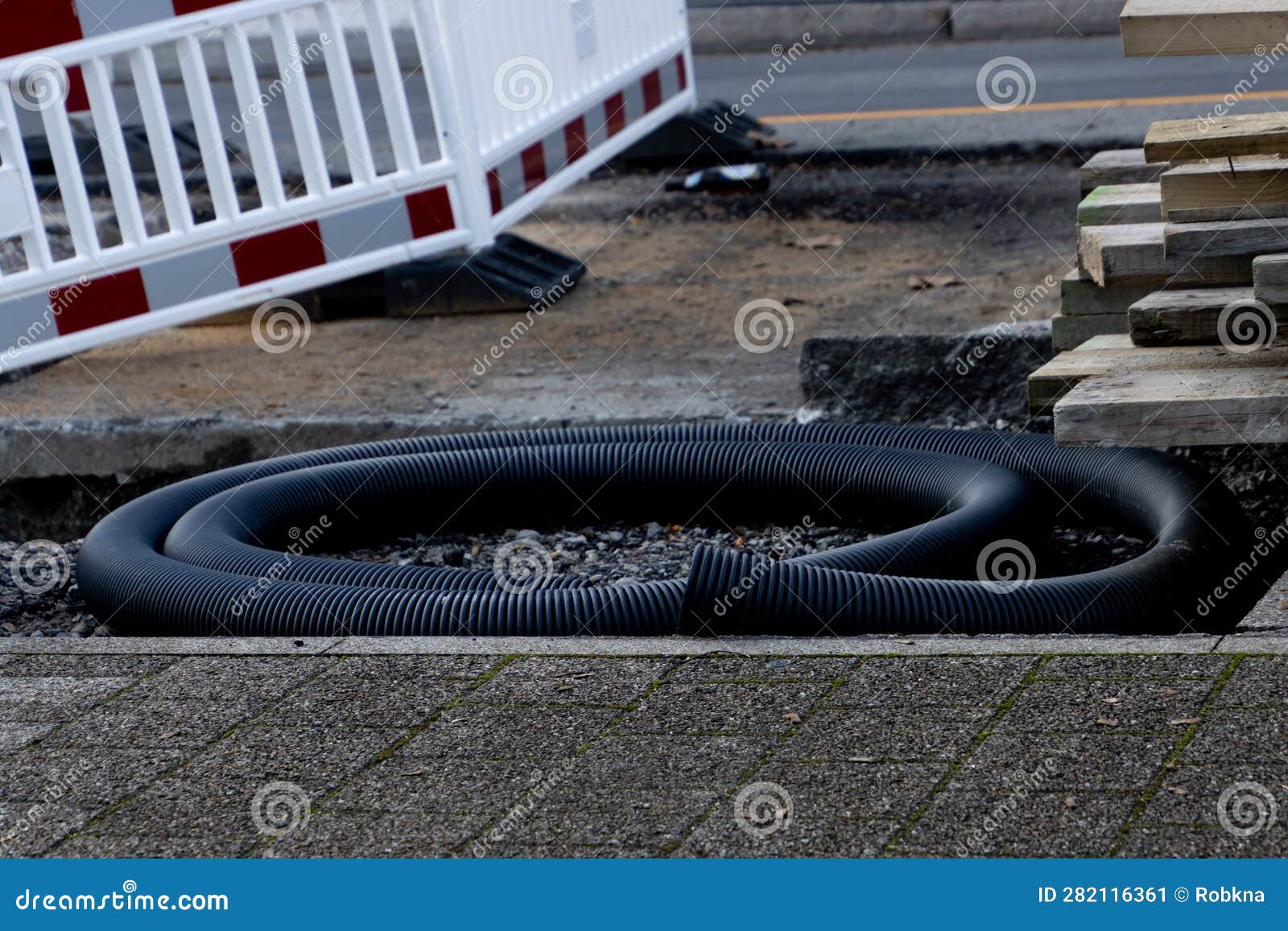 Black Corrugated Plastic Tube Laying on a Construction Site Stock Image ...