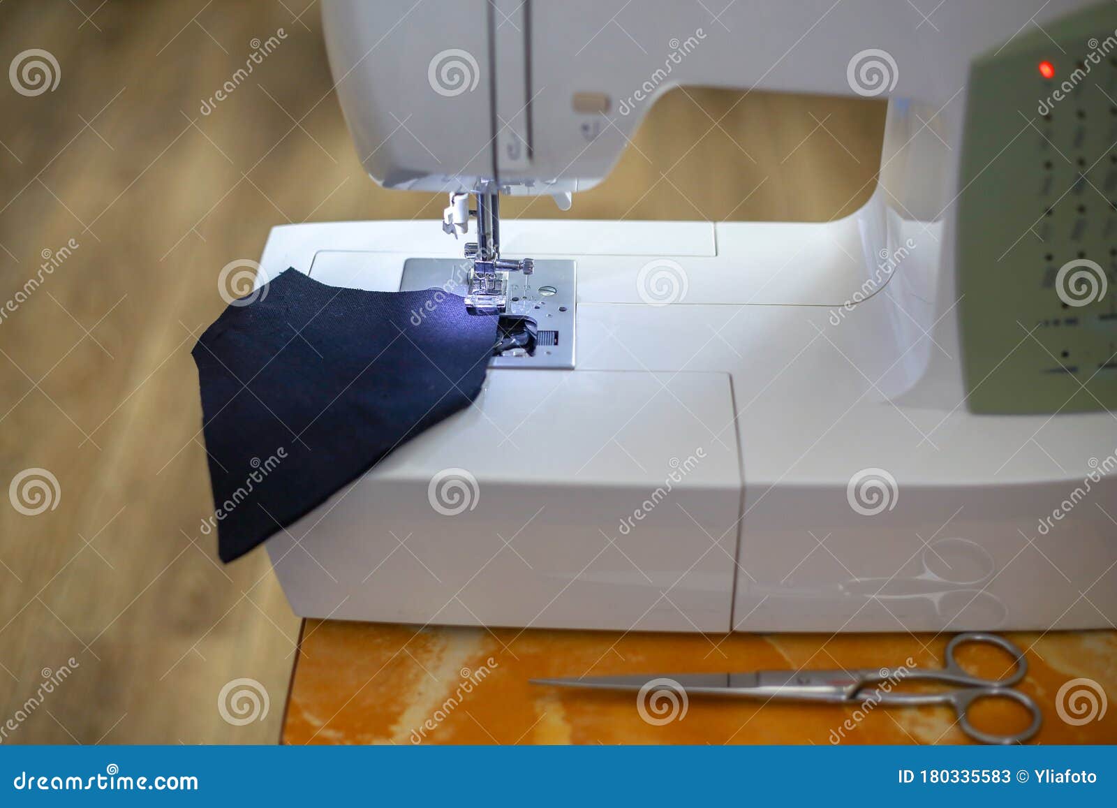 Black Cotton Fabric on a Sewing Machine. Sewing a Face Mask Stock Image ...
