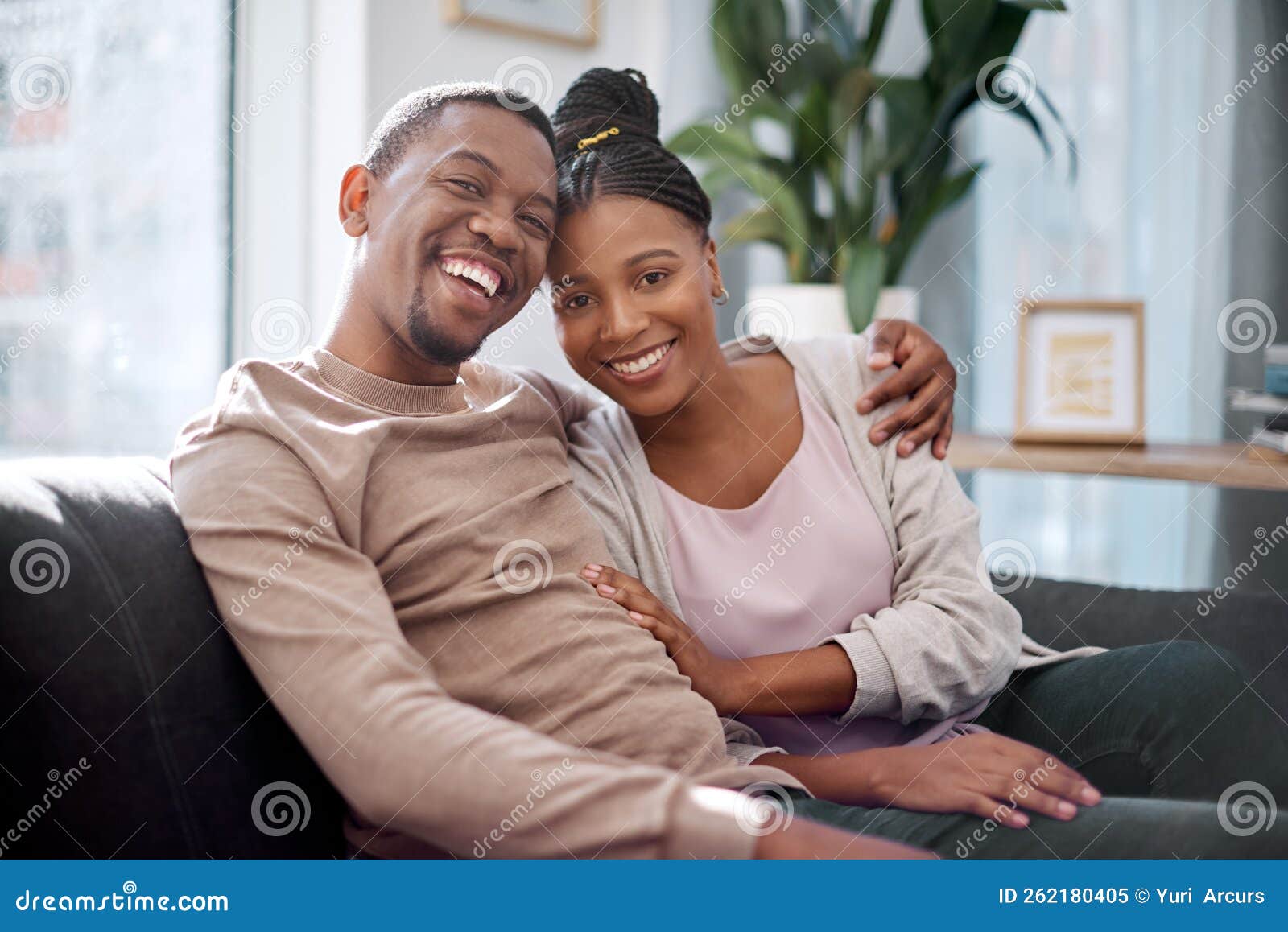 Black Couple Hug And Portrait Smile On Sofa In Relax For Relationship