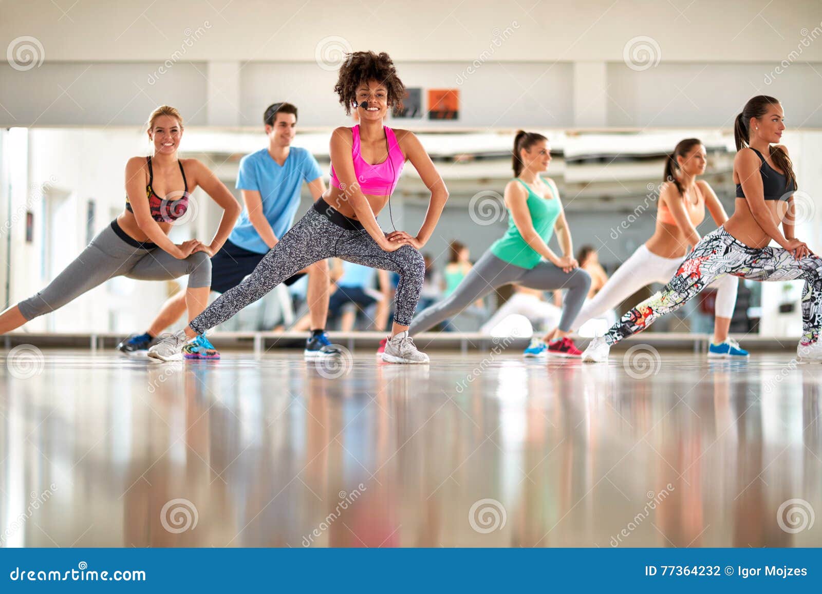 Black Curly Trainer with Group Training Aerobic Stock Photo - Image of ...